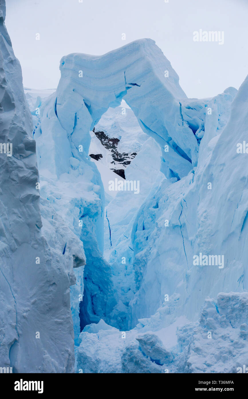 Seracs and an ice arch on a receding glacier at Neko Harbour in ...