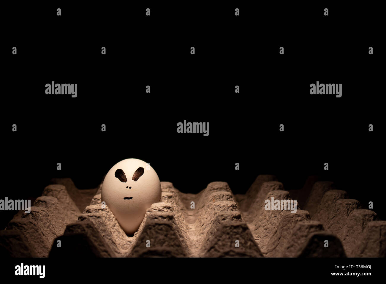 Egg with alien face. Conceptual image Alien egg. Copy Space Stock Photo ...