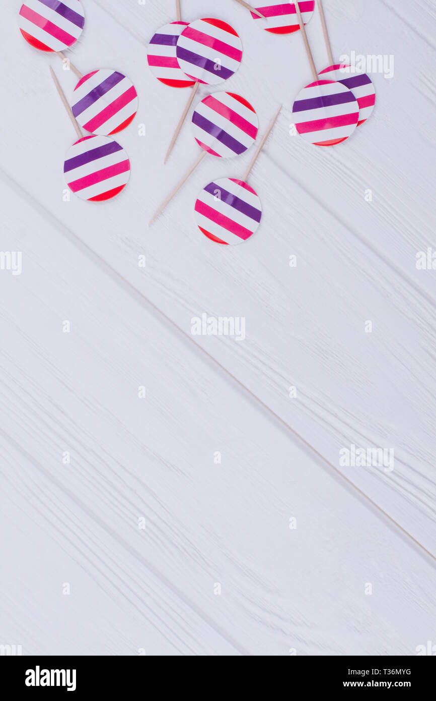 Paper decorations with wooden sticks. Striped paper accessories for ...