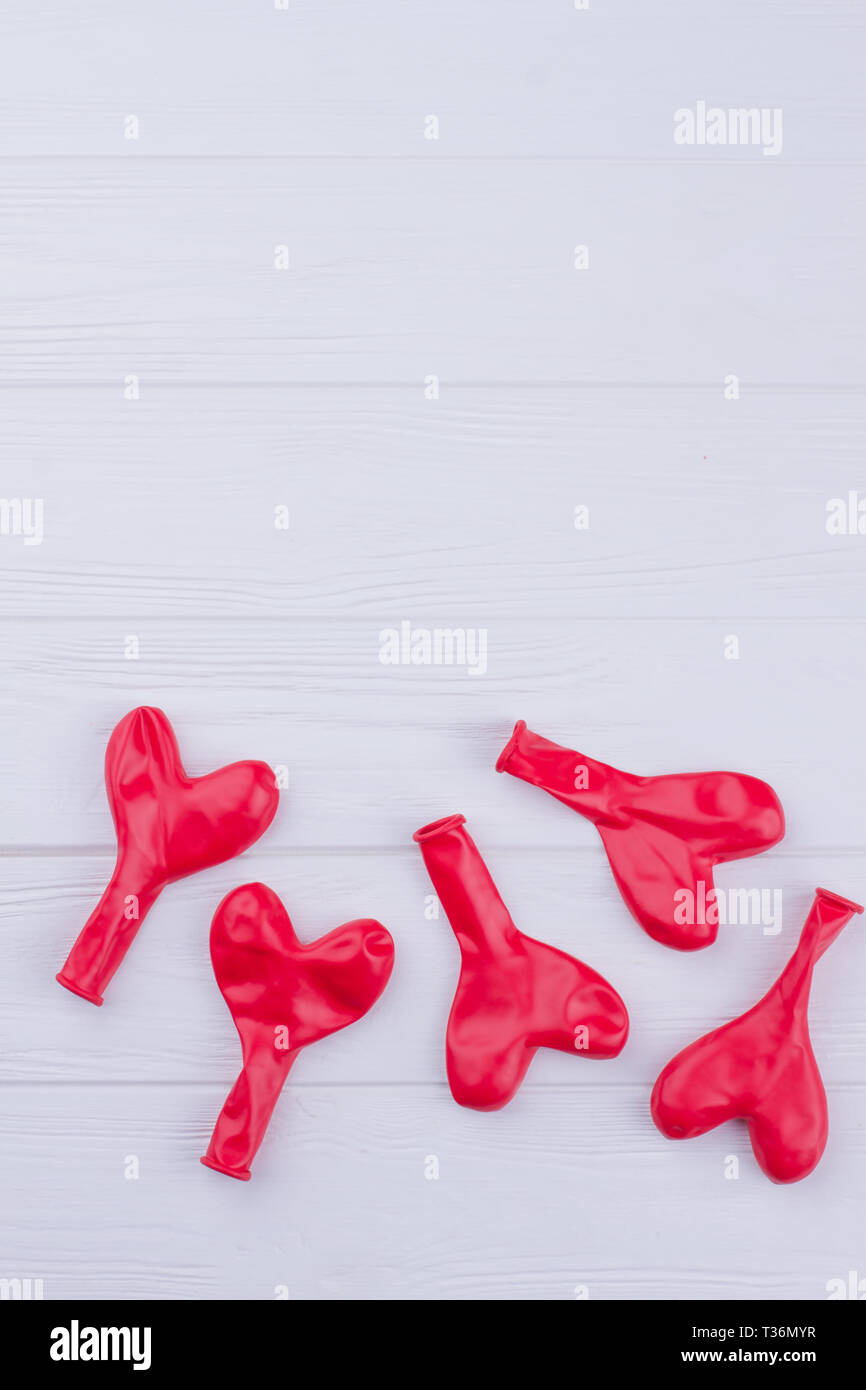 Deflated heart-shaped balloons and copy space. Valentines holiday ...