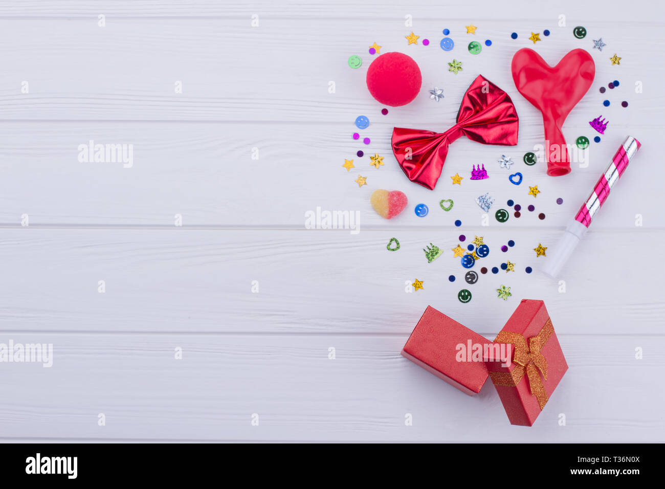 Festive background with colorful party items. Birthday accessories on ...