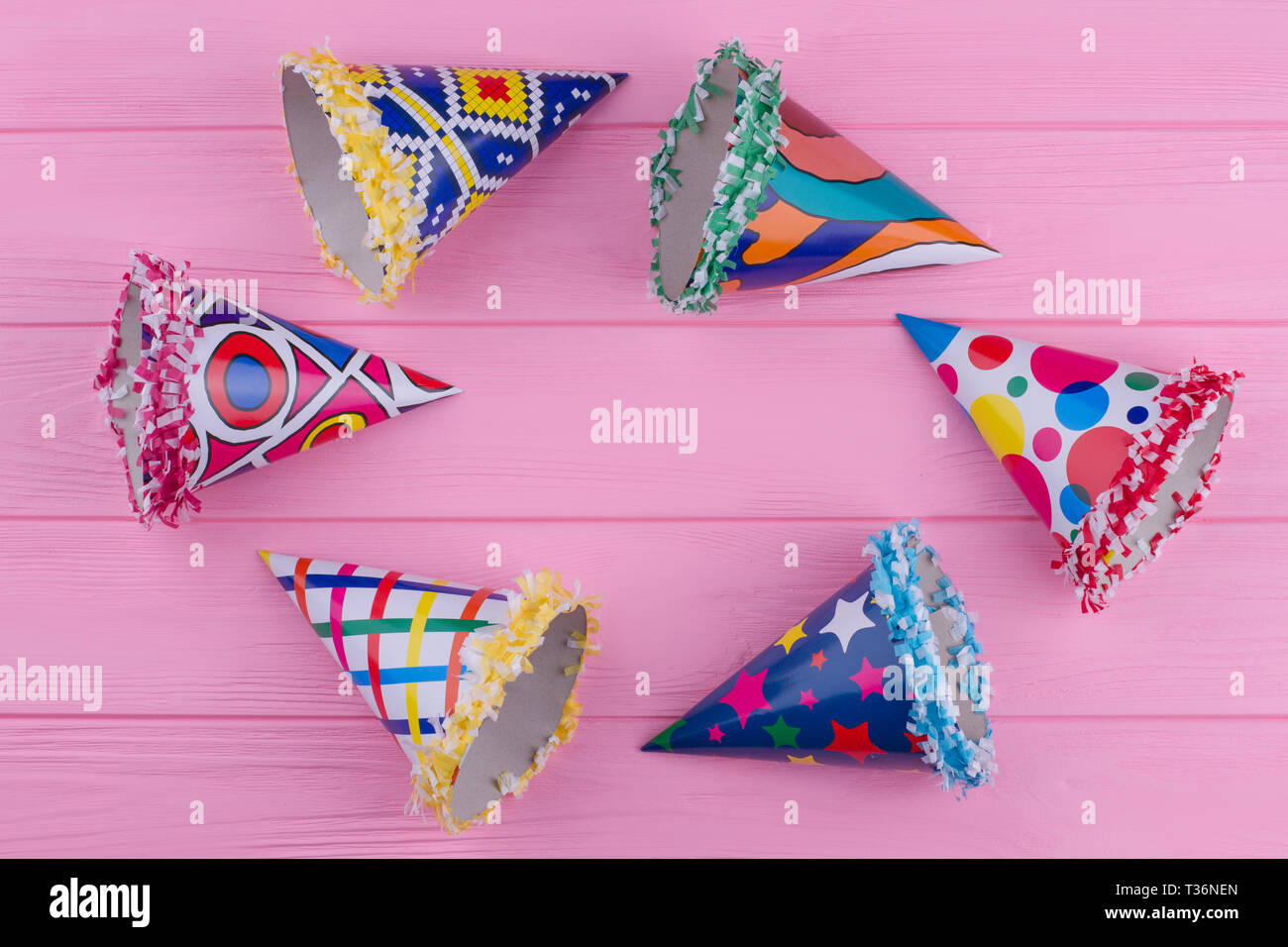 Flat lay party hats with copy space. Frame from party caps on color ...