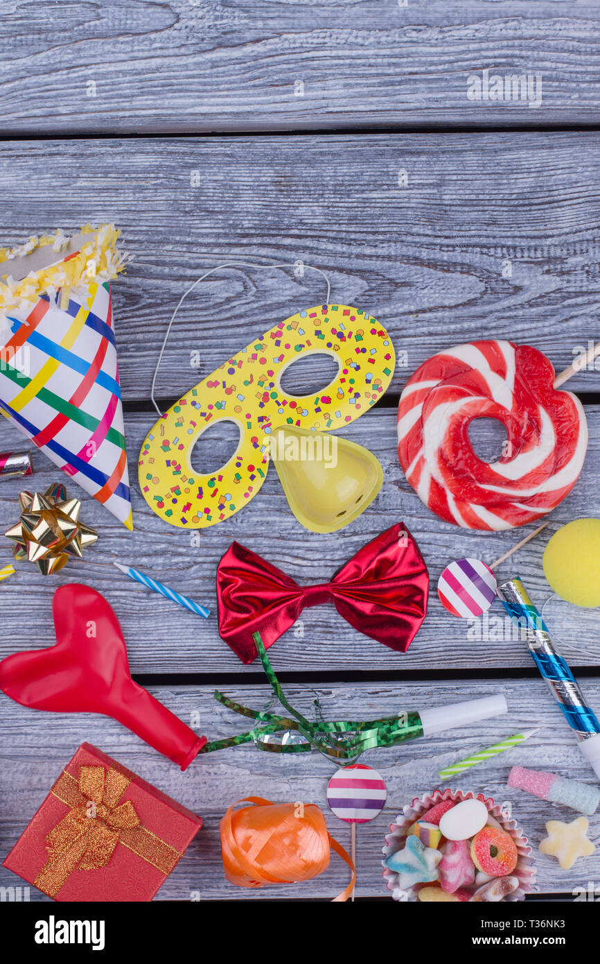 Colorful Birthday party supplies on wooden background. Carnival or ...