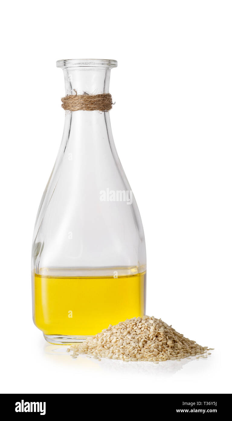 sesame oil in glass bottle and seeds isolated on white background Stock ...