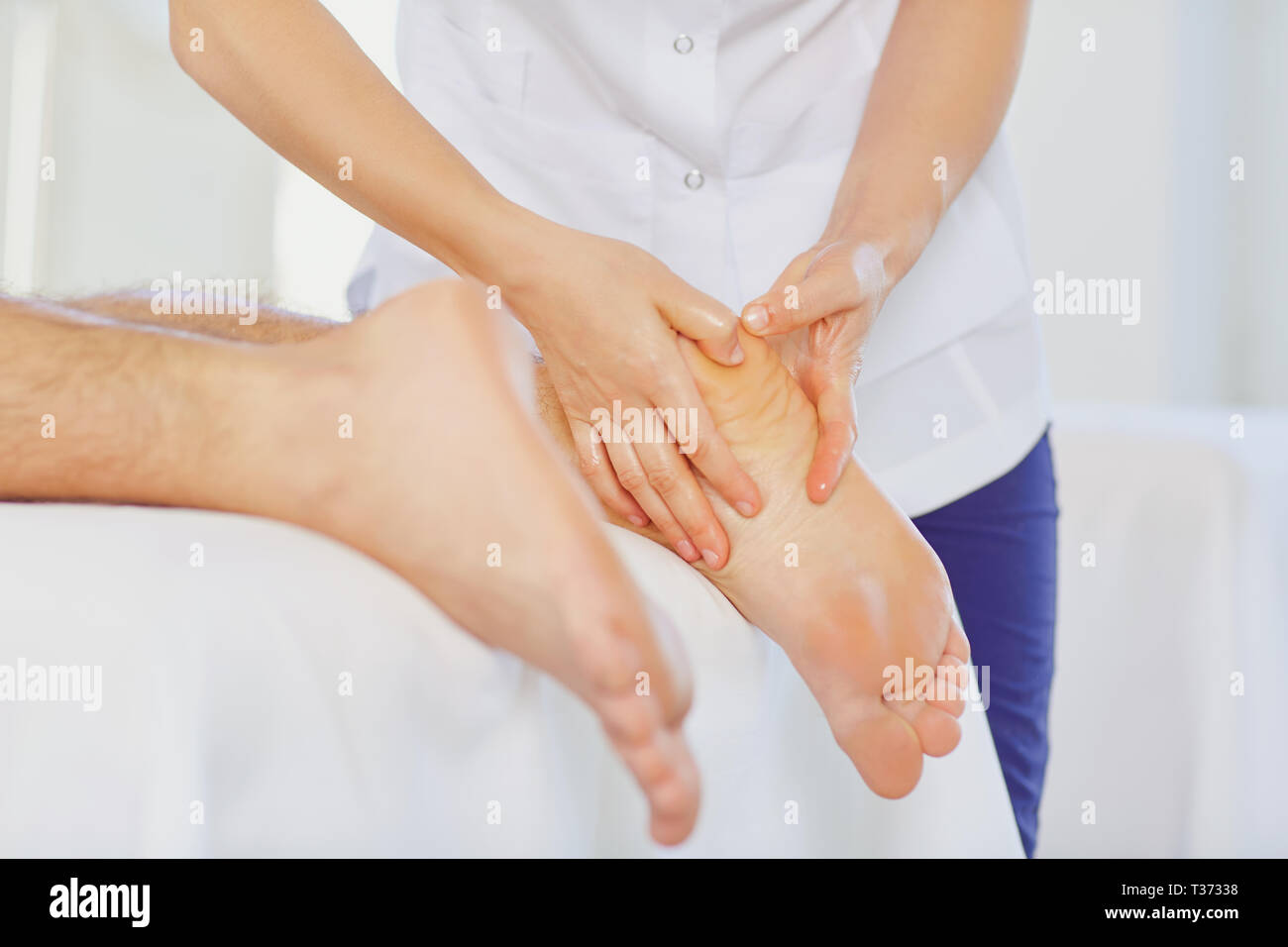 Foot massage in the spa salon Stock Photo - Alamy