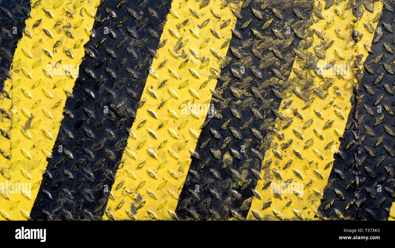 Black and yellow line paint on non-slip metal background Stock Photo ...