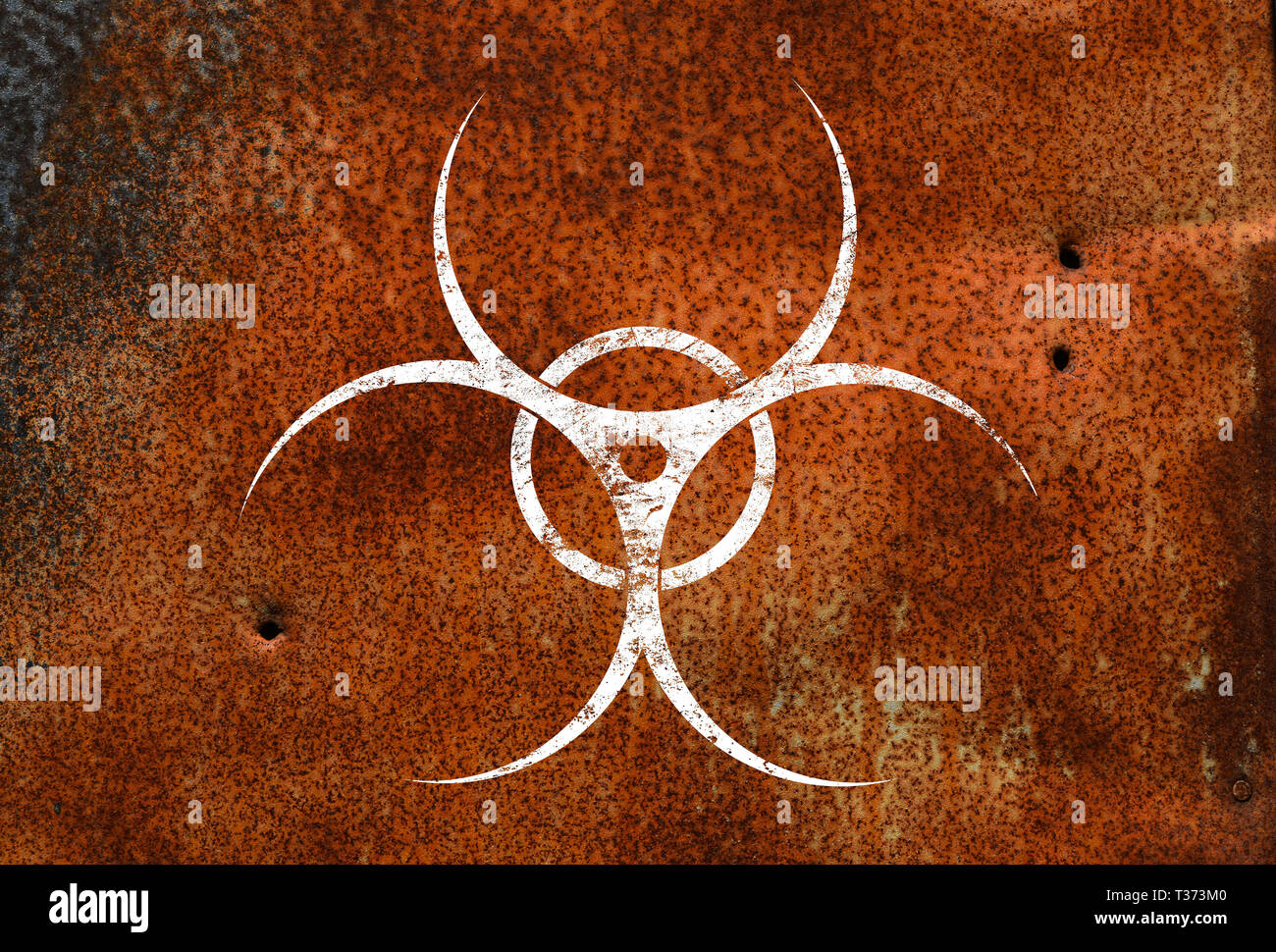White biohazard warning sign painted over grunge red rusty corroded ...