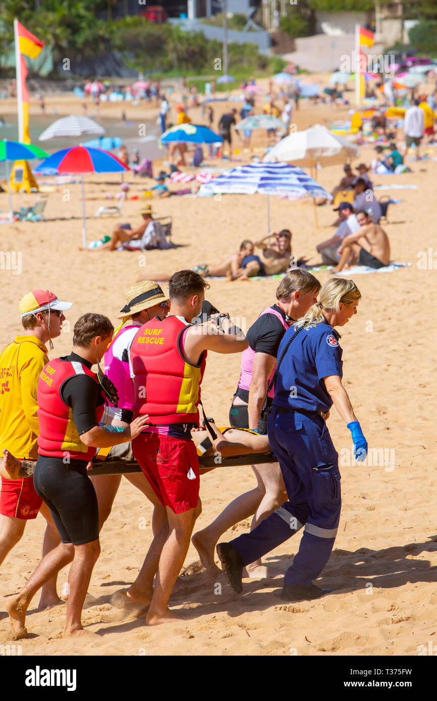 A near drowning victim carried off Palm beach on a stretcher by surf ...