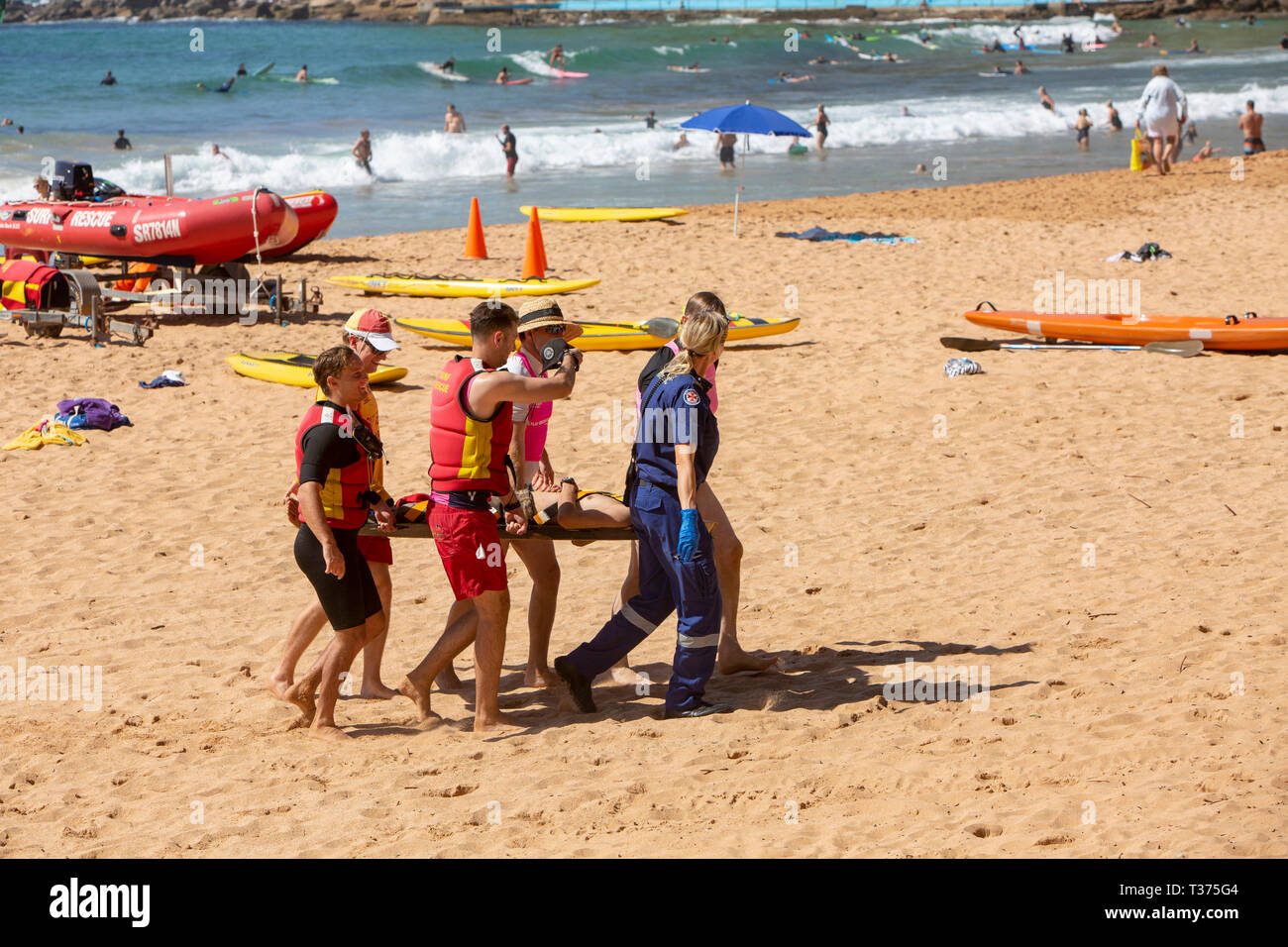 A near drowning victim carried off Palm beach on a stretcher by surf ...