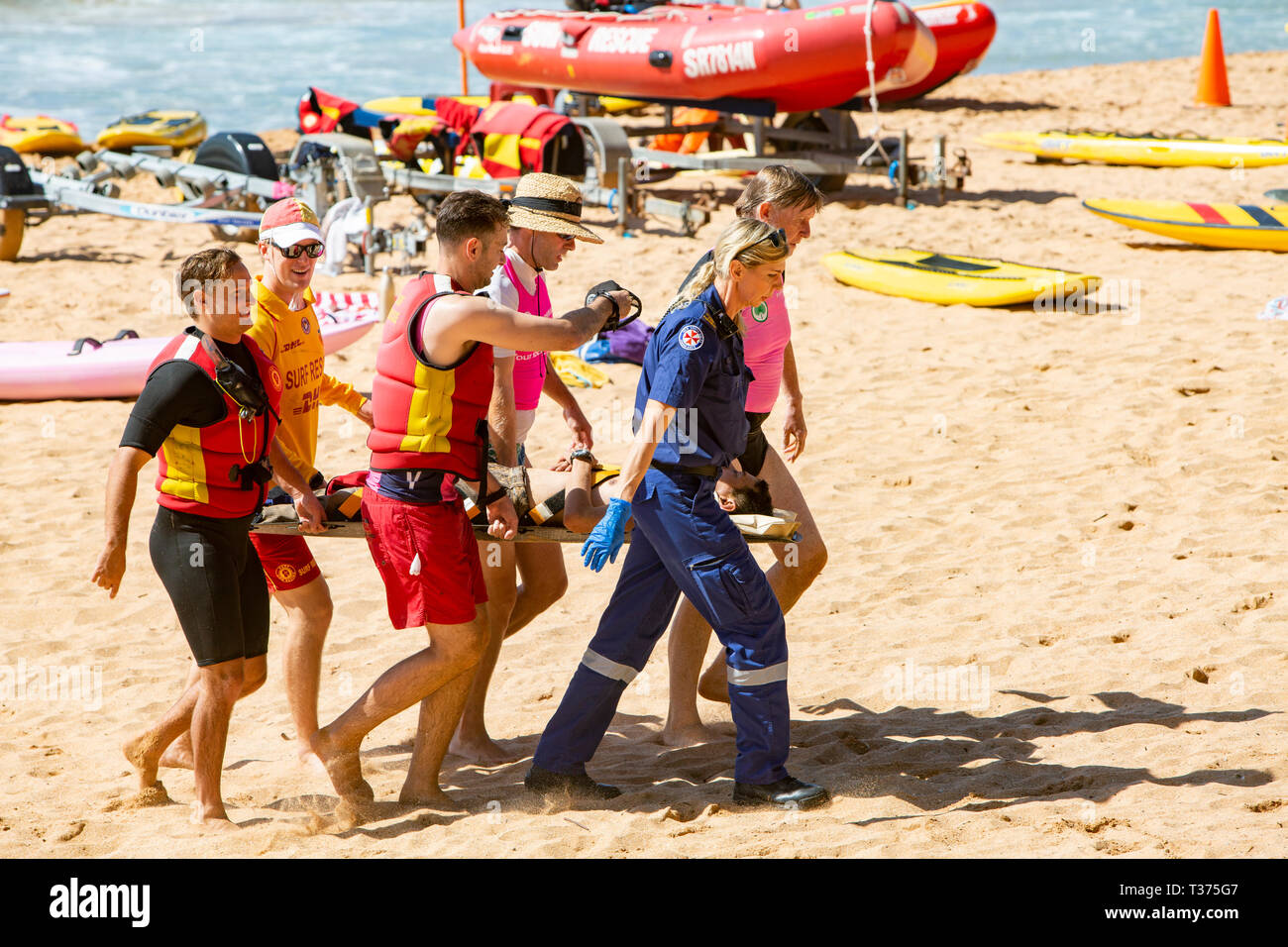 A near drowning victim carried off Palm beach on a stretcher by surf ...