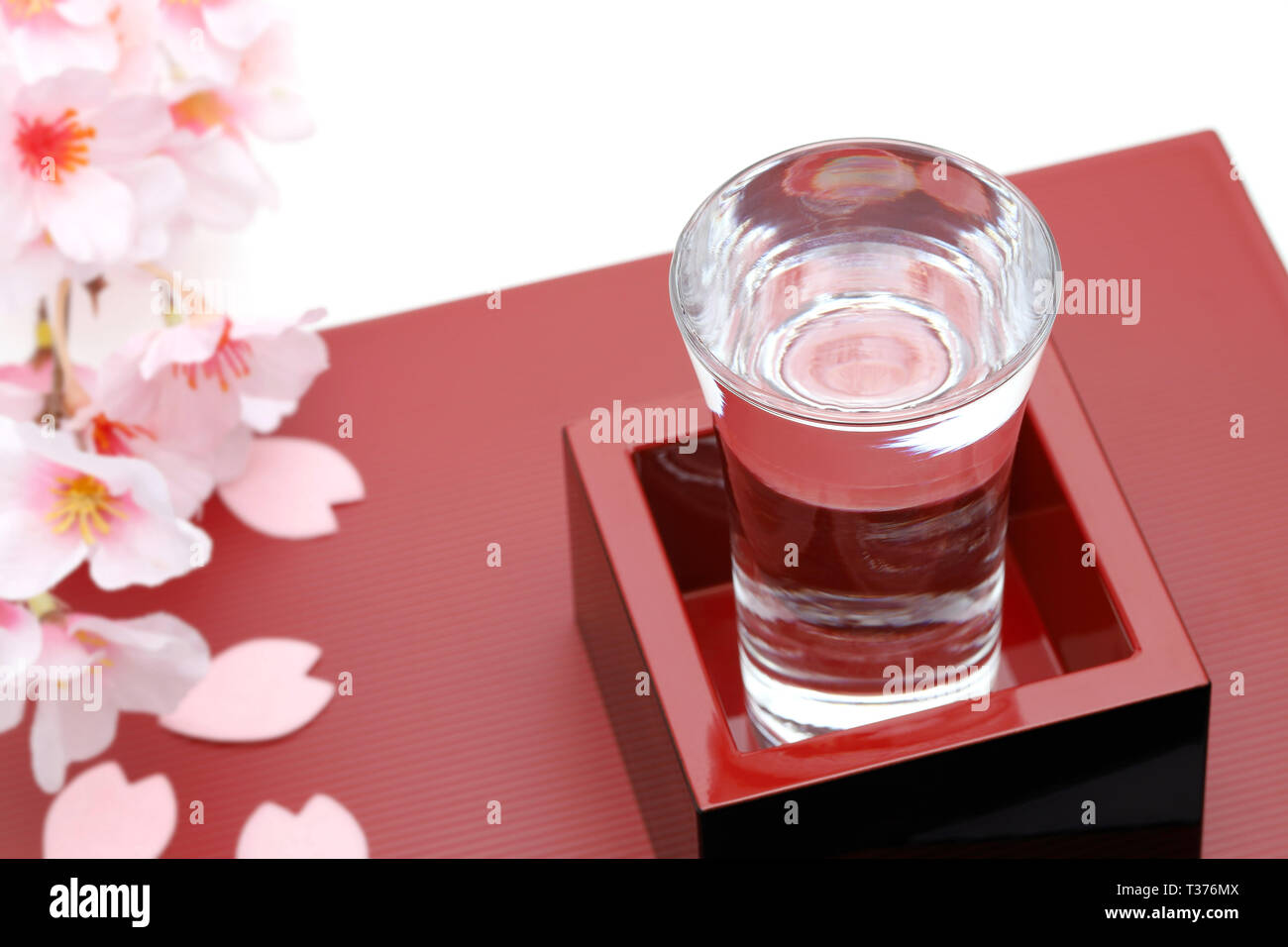 Japanese wooden box masu with sake isolated on white background Stock ...