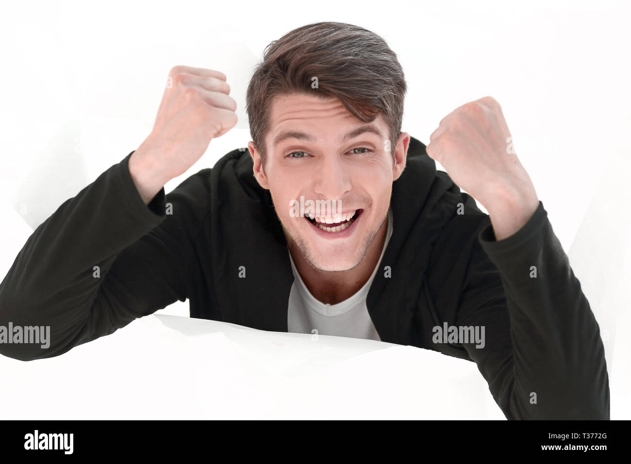 close up.purposeful young man, breaking through a paper wall Stock ...