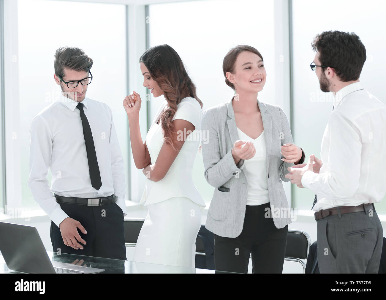 young employees talk in the office Stock Photo - Alamy