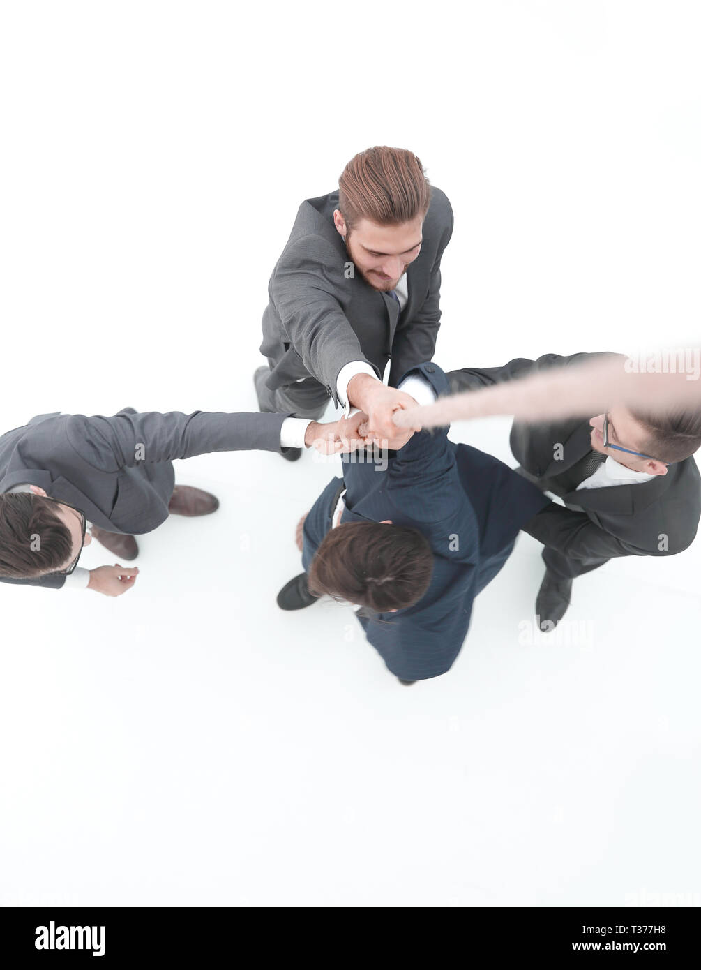 smiling business team holding the rope Stock Photo - Alamy