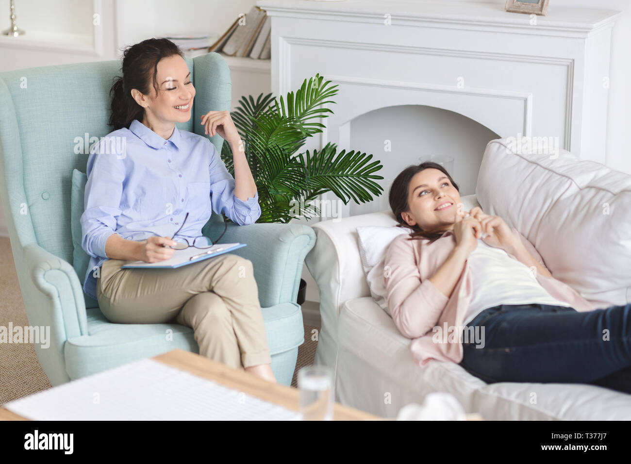 Young woman dreaming about new life at life counselor Stock Photo - Alamy