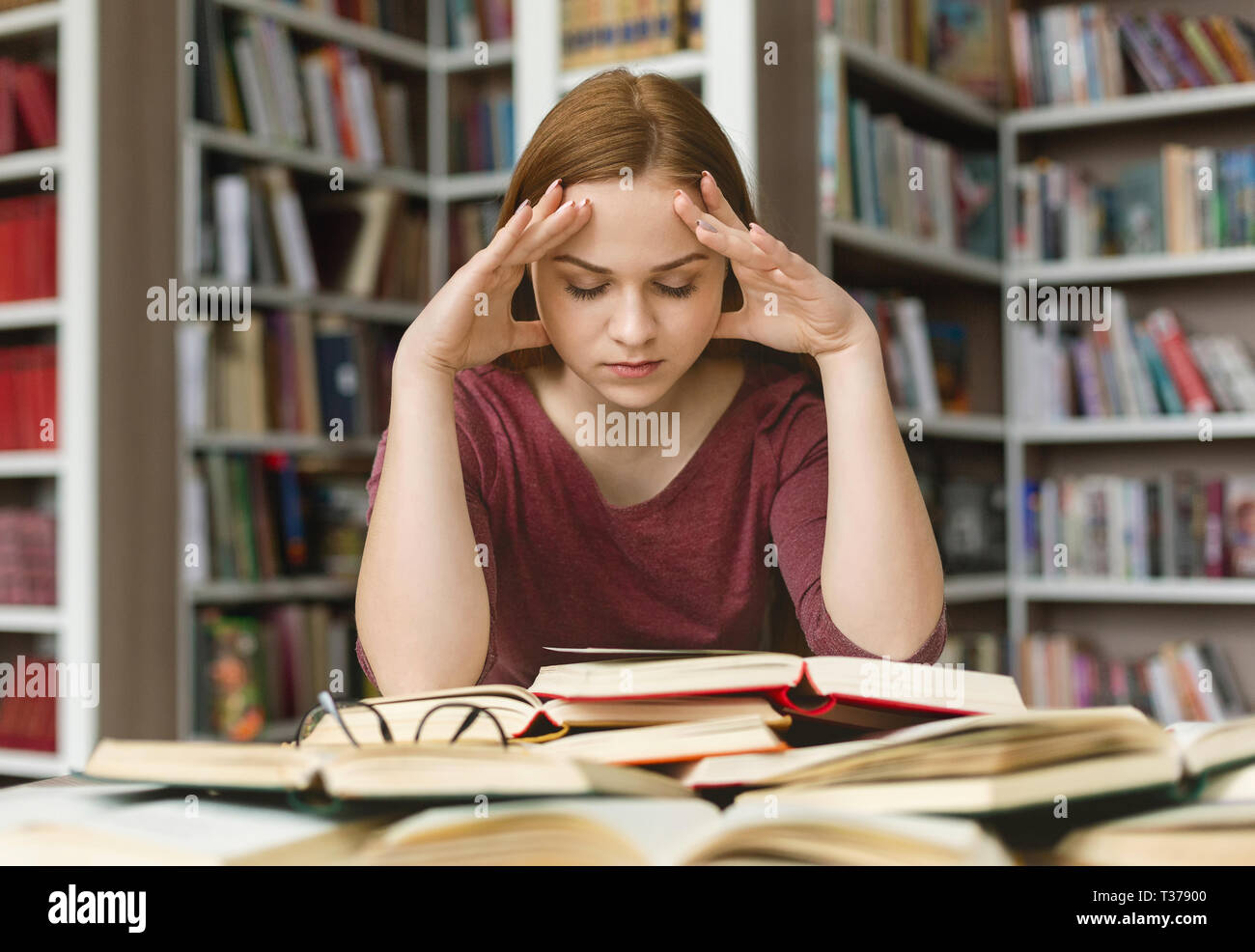 Girl Studying In Library