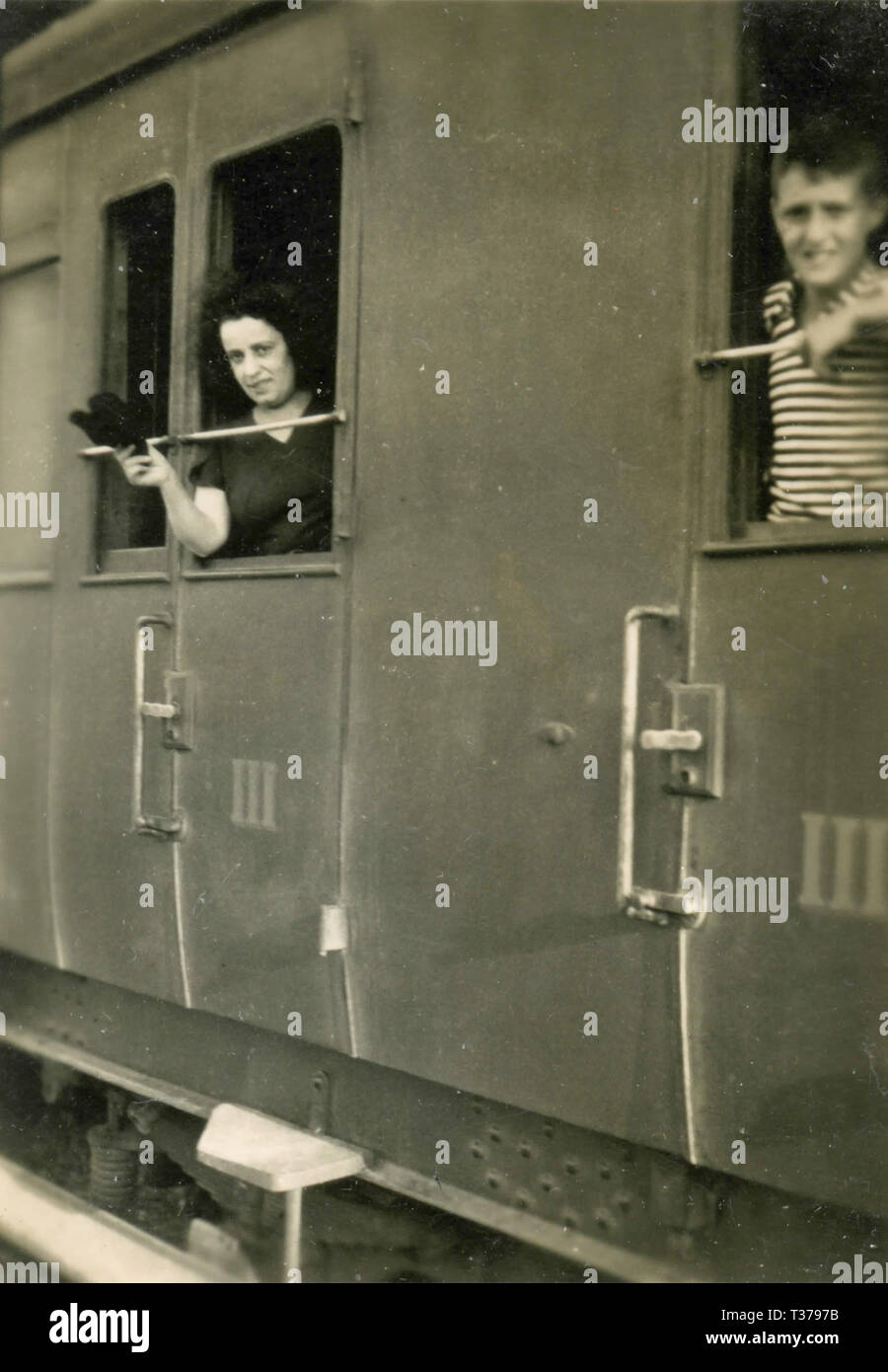 Third class train passenger waving goodby, Italy 1950s Stock Photo - Alamy