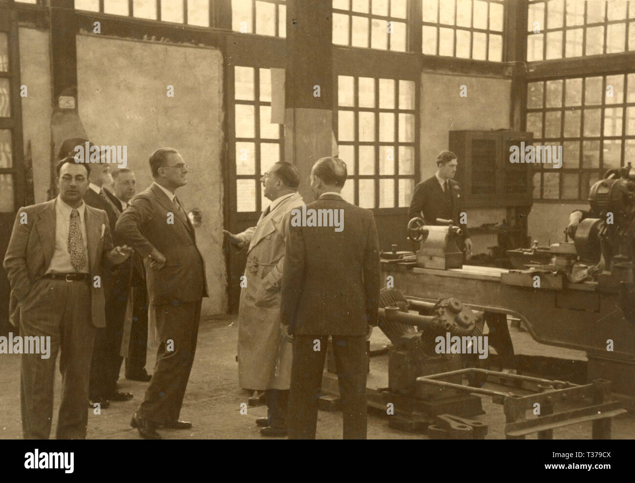 Visit to the factory, Italy 1930s Stock Photo - Alamy