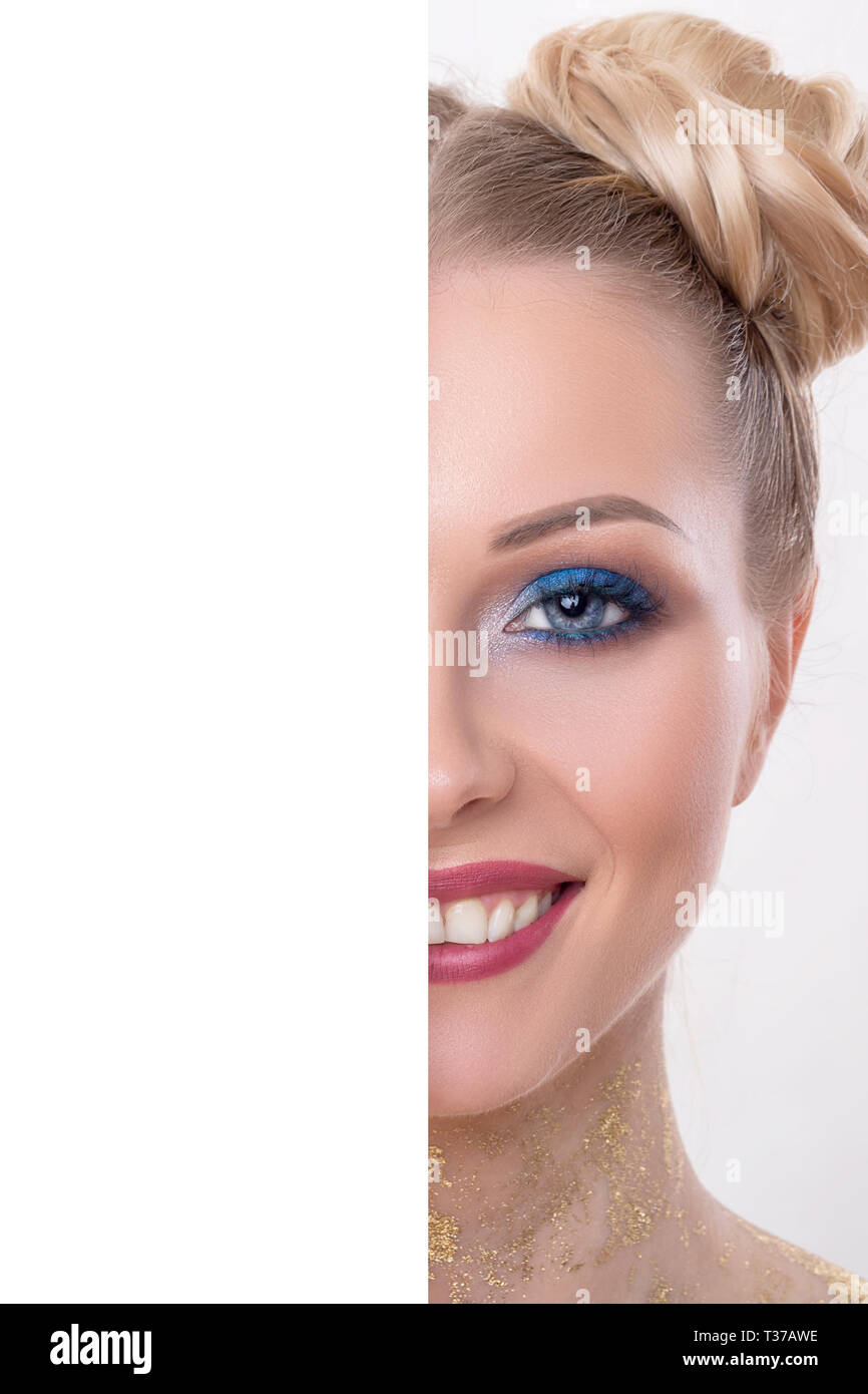 half beauty face with blank board concept, Close up half face portrait ...