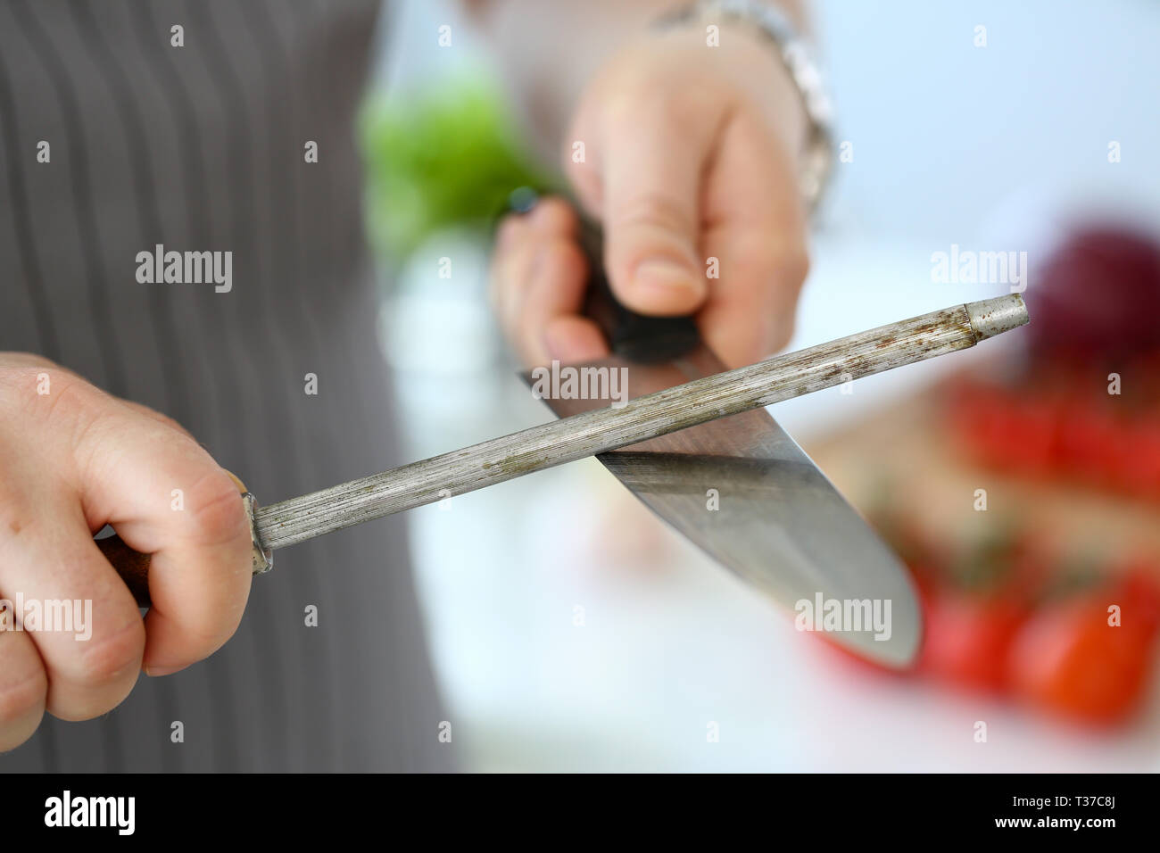 Cook holds number and musat in his hand Stock Photo - Alamy