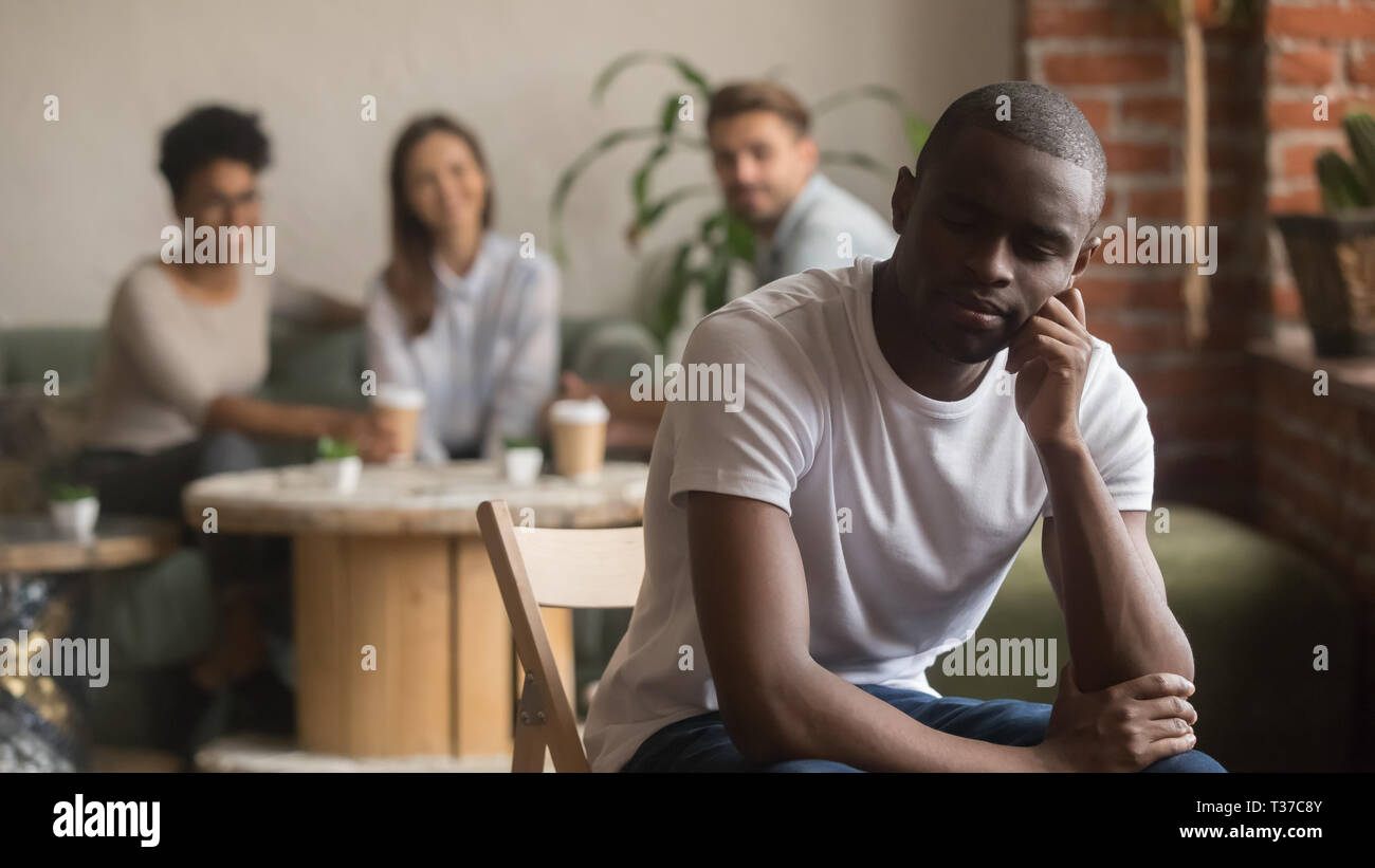 Upset lonely african american man suffering from bullying racial ...