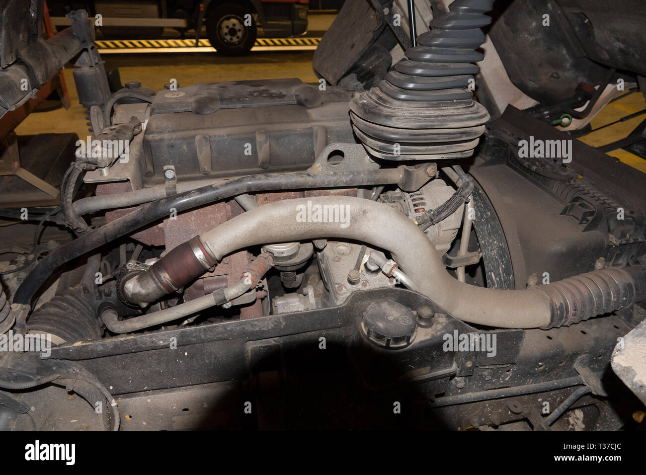 Man truck with the cab tilted to show engine for maintenance or repair ...