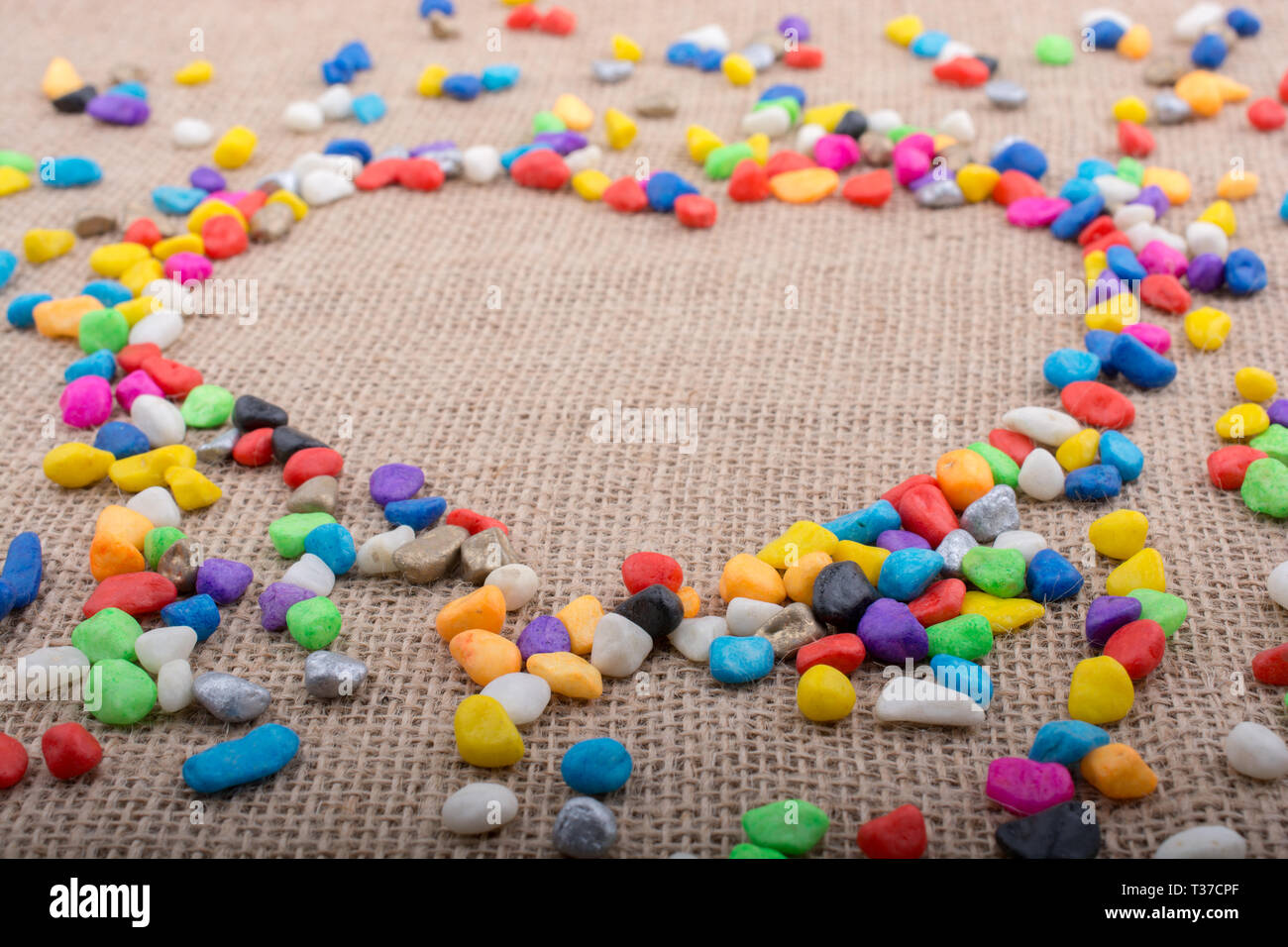 Heart shape pebbles on texture hi-res stock photography and images - Alamy