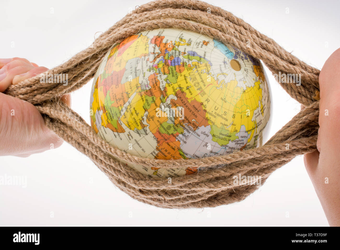 hands holding the globe wrapped in rope Stock Photo - Alamy