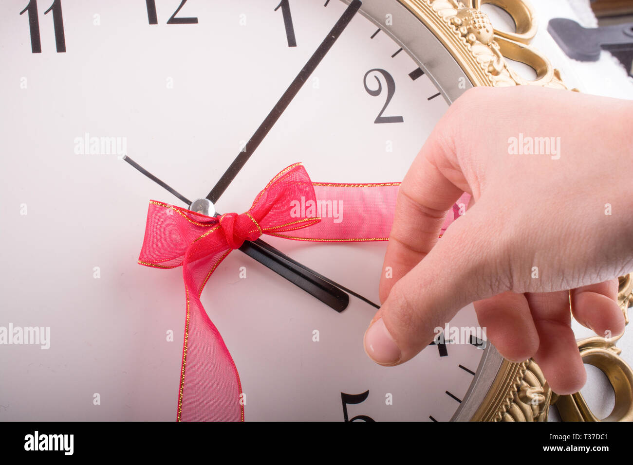 clock with ribbon in it Stock Photo - Alamy