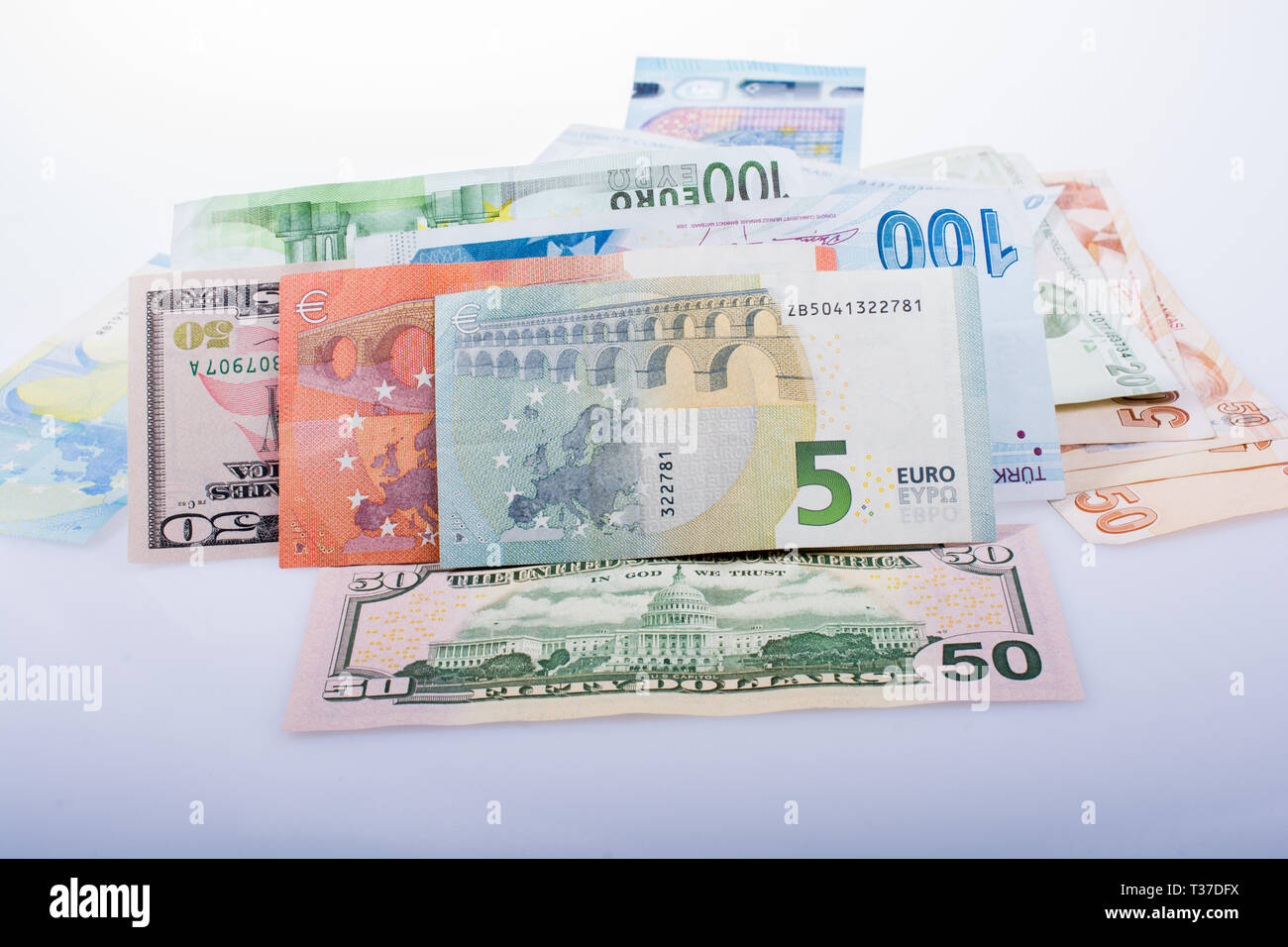 Hand holding American dollar banknotes isolated on white background ...