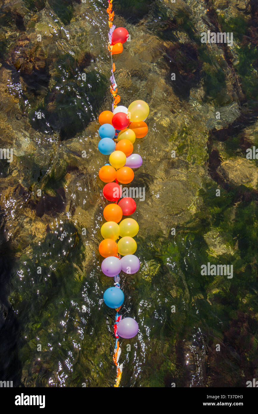 Balloons in shooting range as targets on water Stock Photo - Alamy