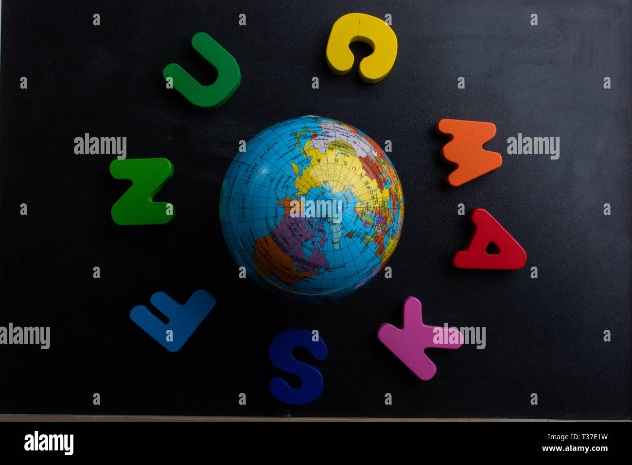 Colorful letters forming a circle around a globe in the view Stock ...