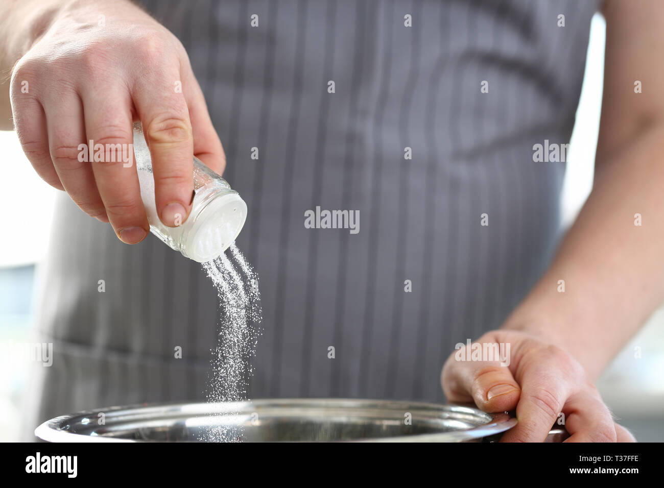 Man sprinkle salt hi-res stock photography and images - Alamy
