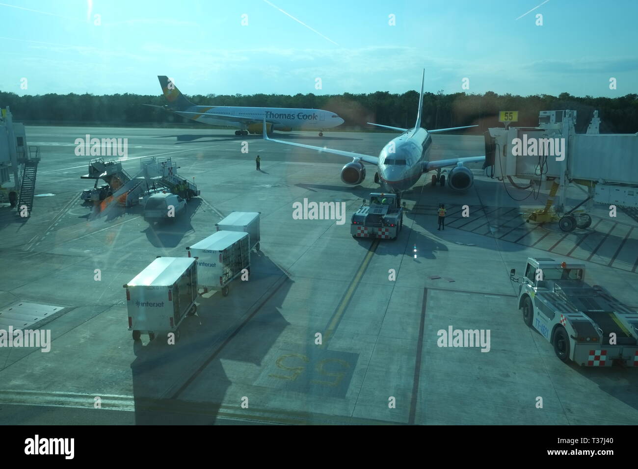 Cancun International Airport, Mexico. Aircraft being readied before ...