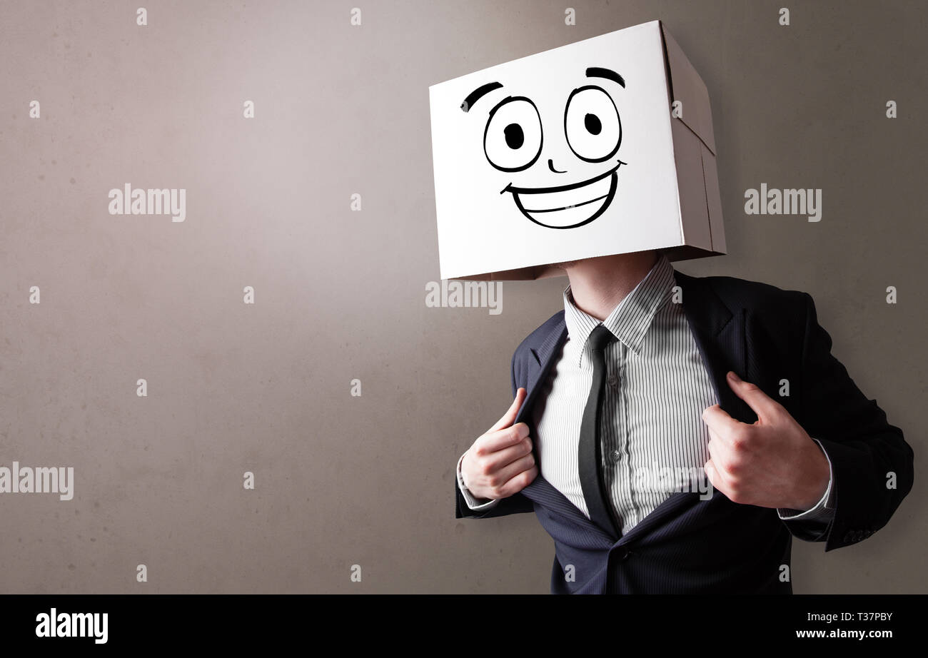 Young boy standing and gesturing with a cardboard box on his head Stock ...