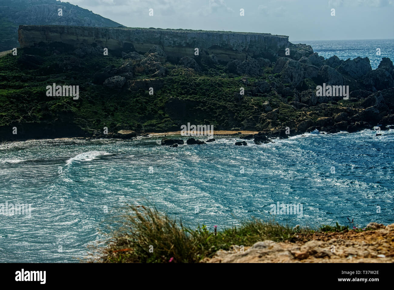 A small secret beach. A small sandy beach in Mellieha, Malta Stock ...