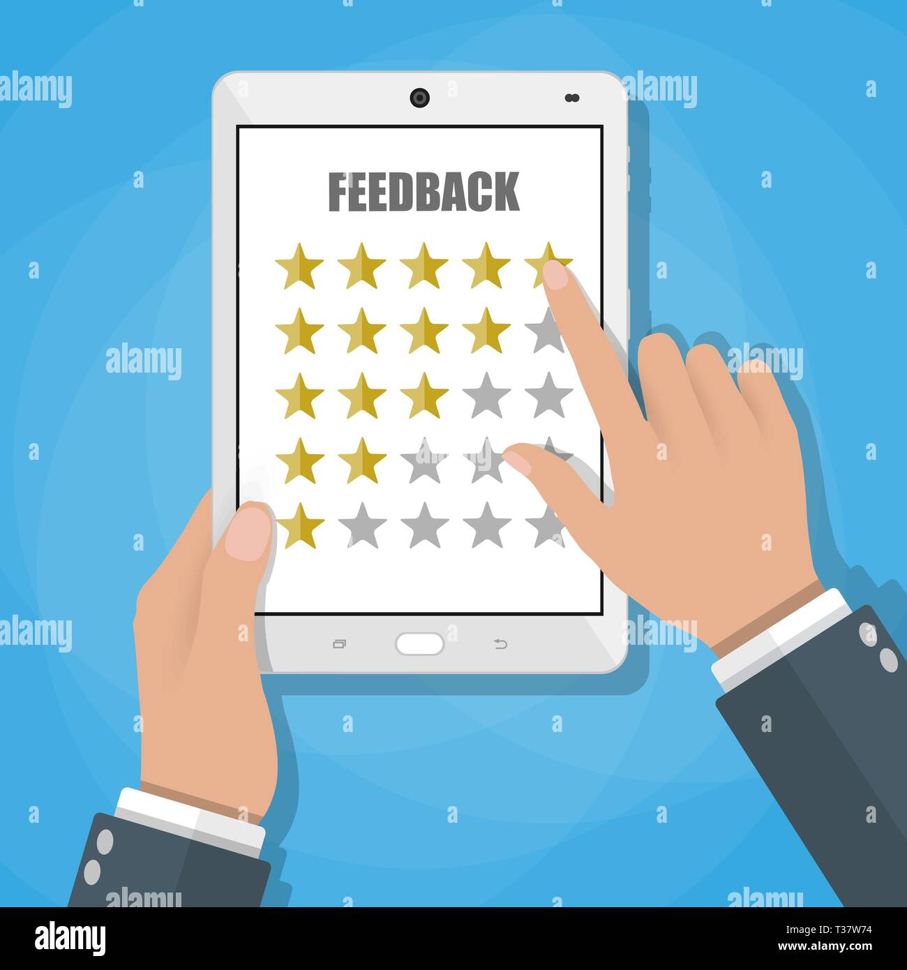 Hand holding and pointing ttablet touch screen with fife rate stars ...