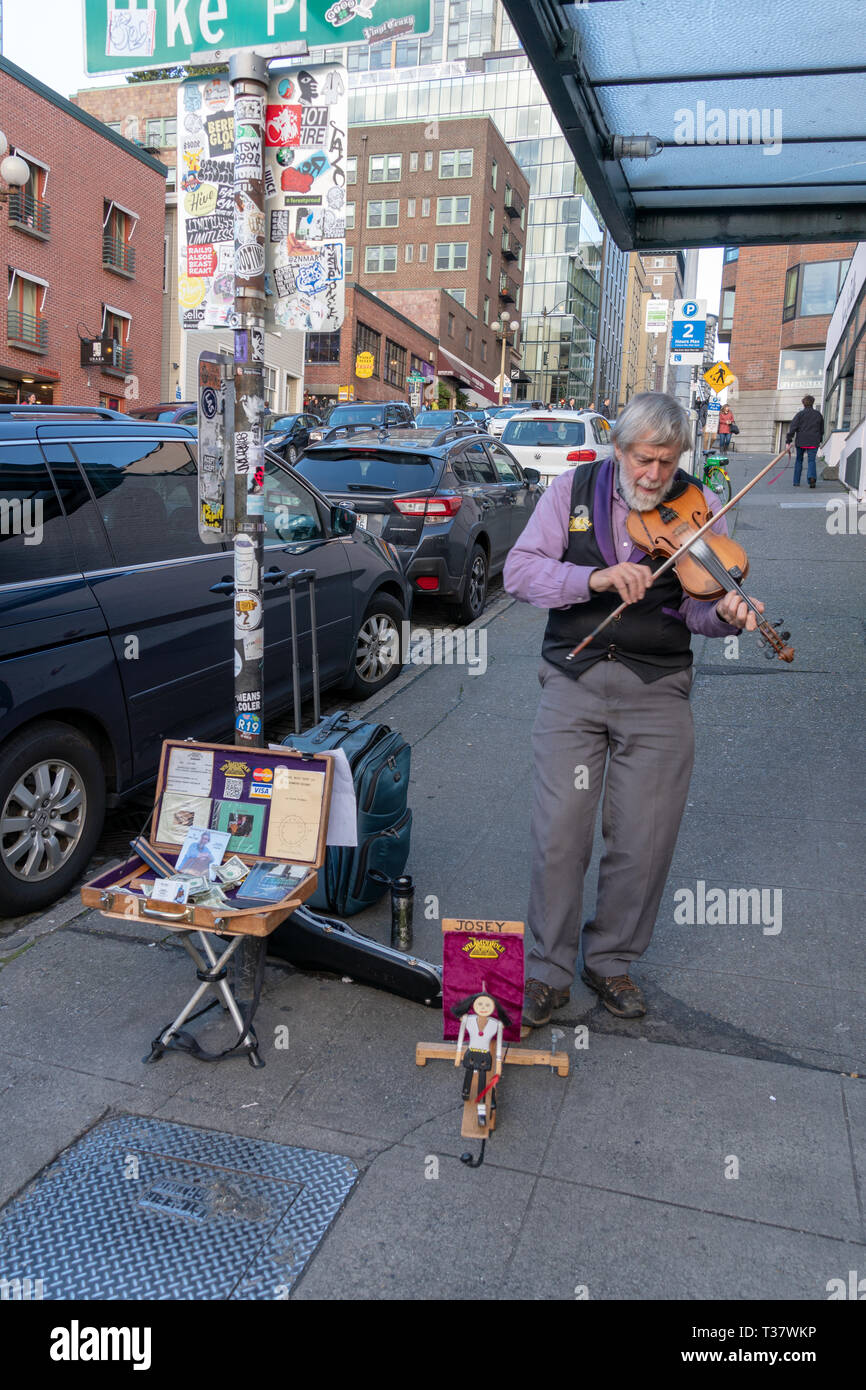 Seattle, Washington - 2018-12-30 - Musician playing violin on the ...