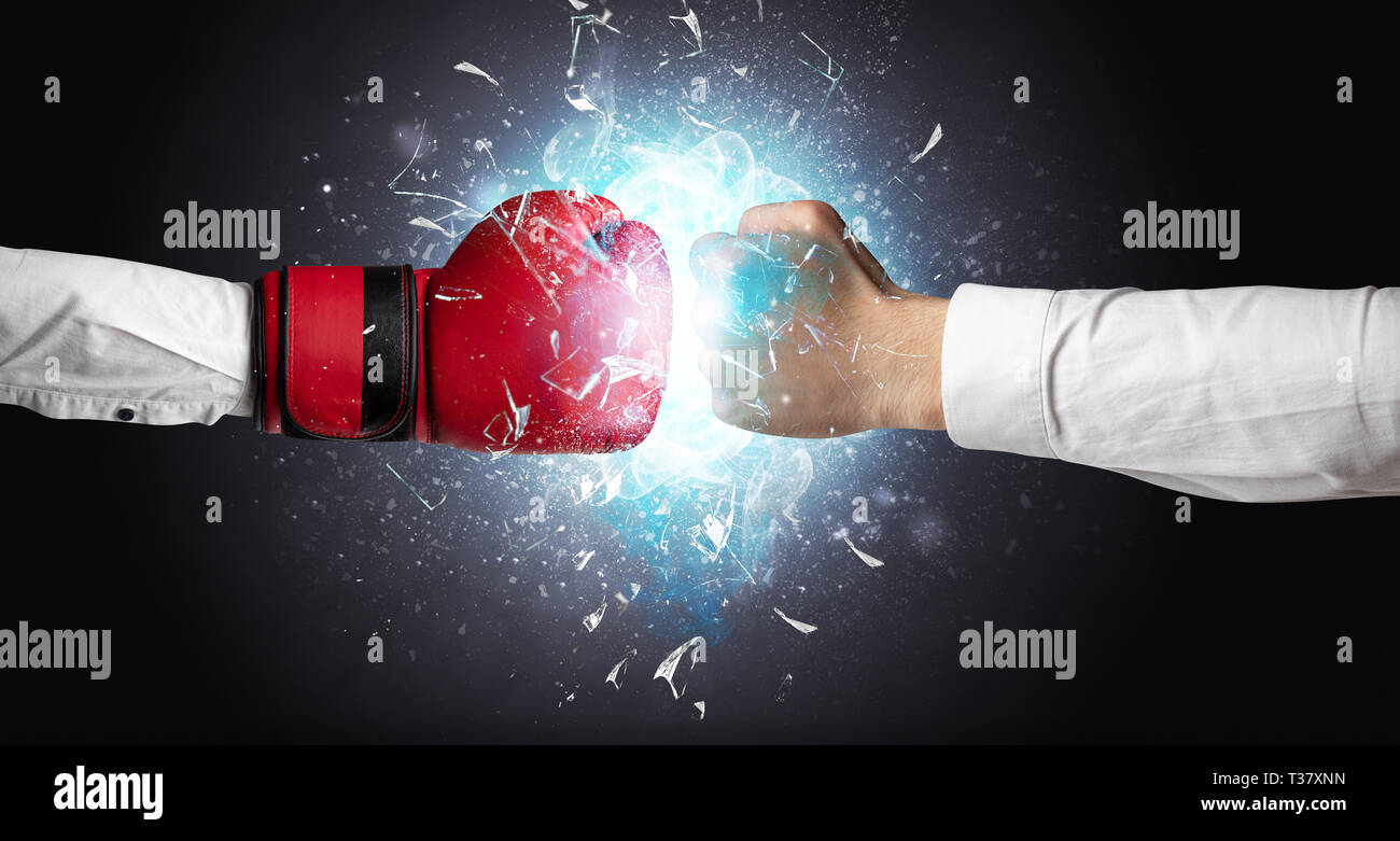 Two hands fighting and breaking glass into small pieces with blue light ...