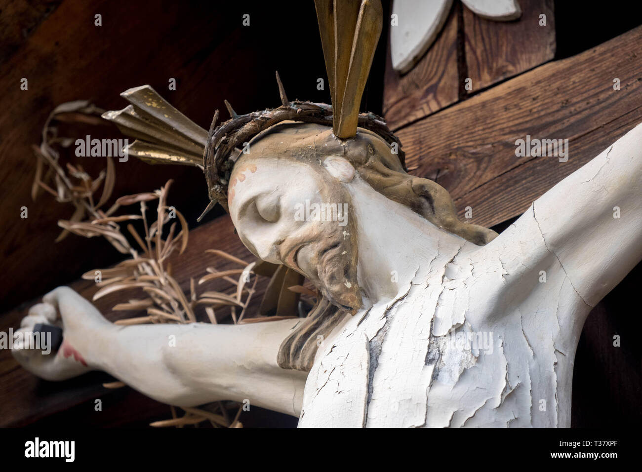 Holy Crucified Jesus Christ close-up. Ancient wooden sculpture Stock Photo - Alamy