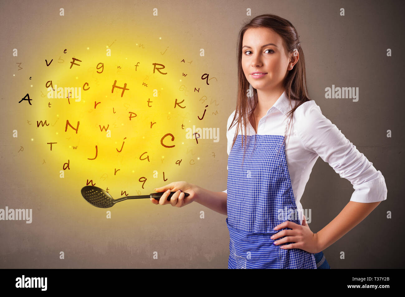 Young person cooking letters in wok Stock Photo - Alamy