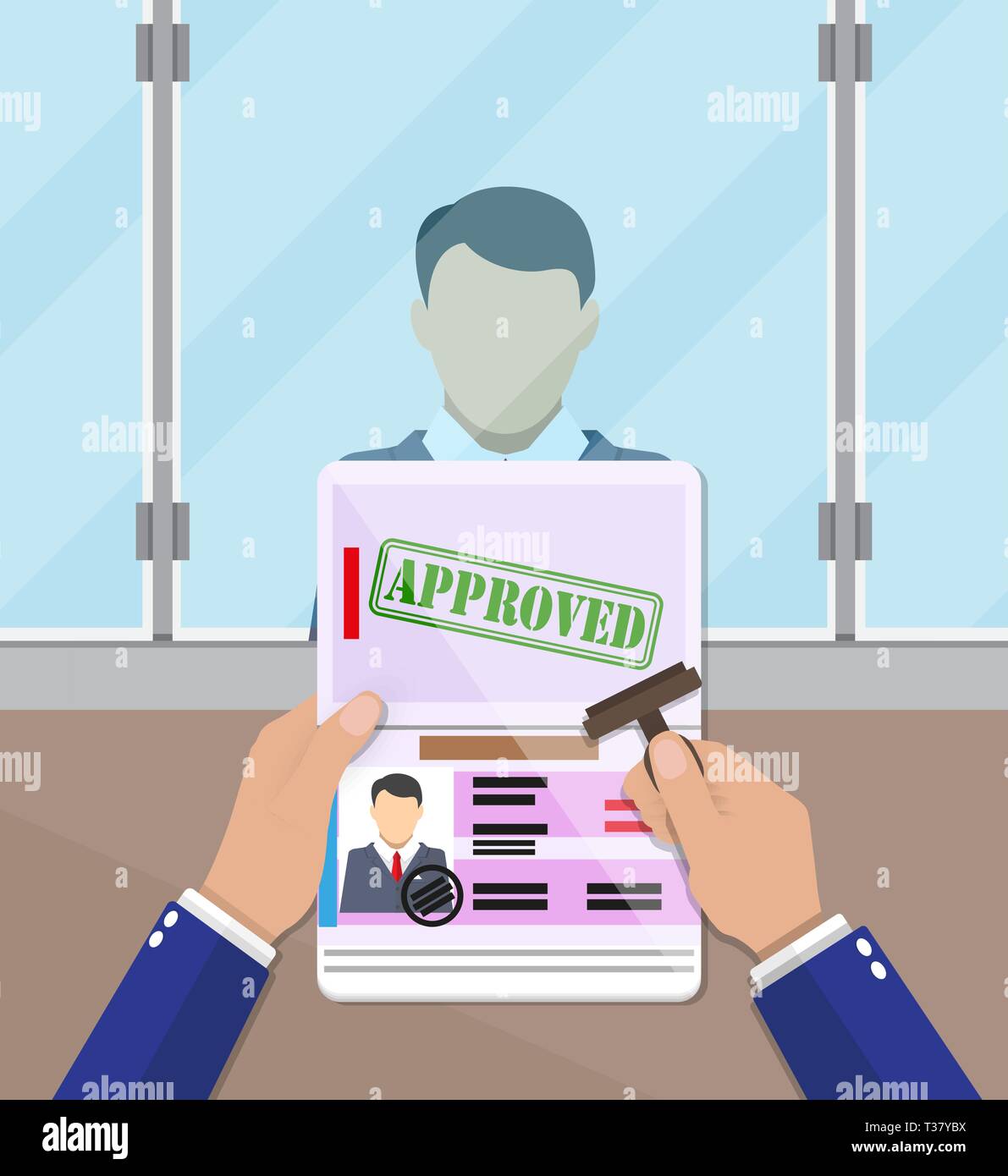 officer at passport control point putting a stamp in the passport with ...