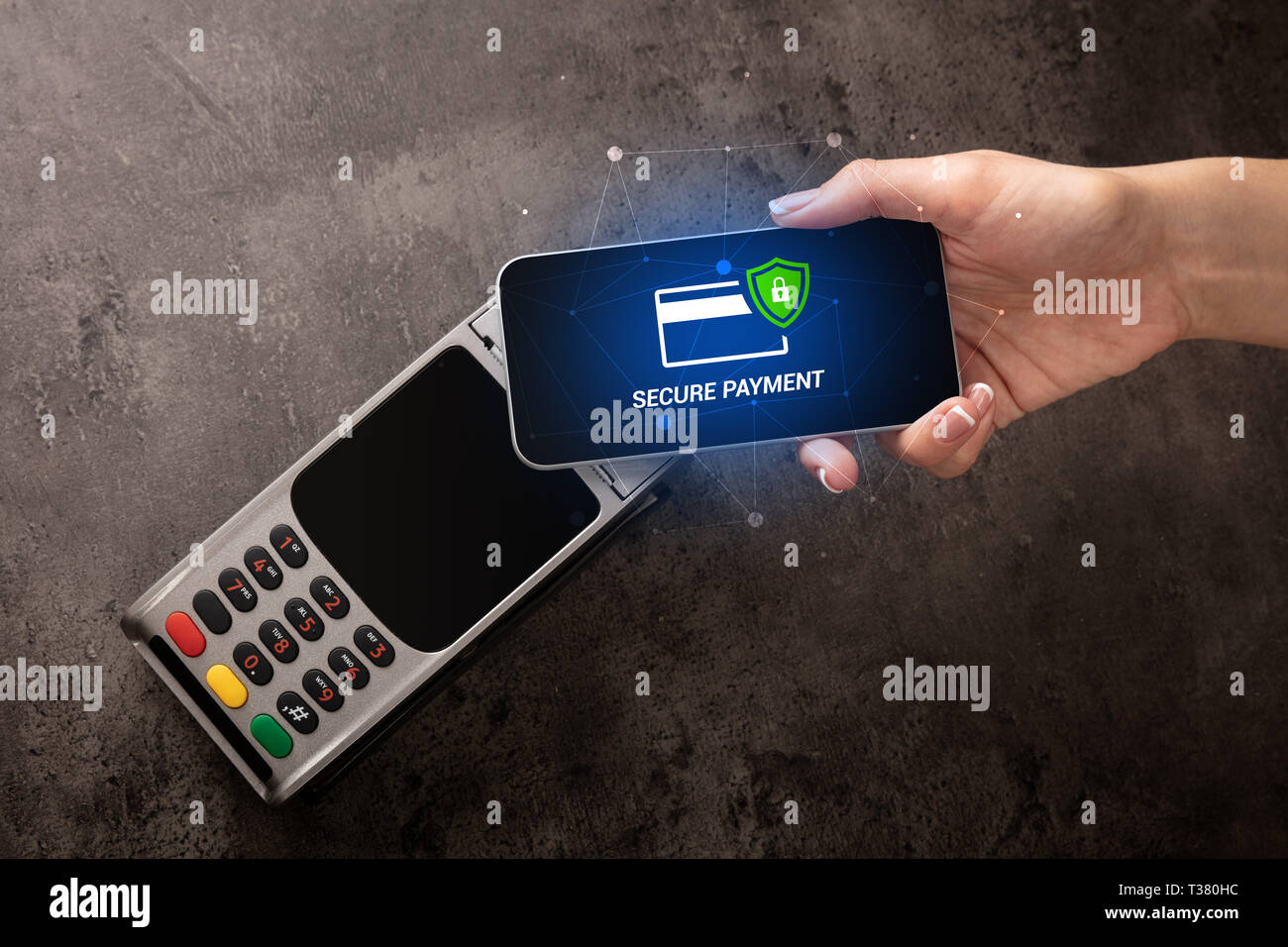 Hand paying on terminal with smartphone in secure payment system Stock ...