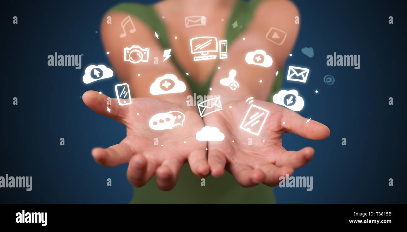 Hand holding application icons and symbols in her hand Stock Photo - Alamy