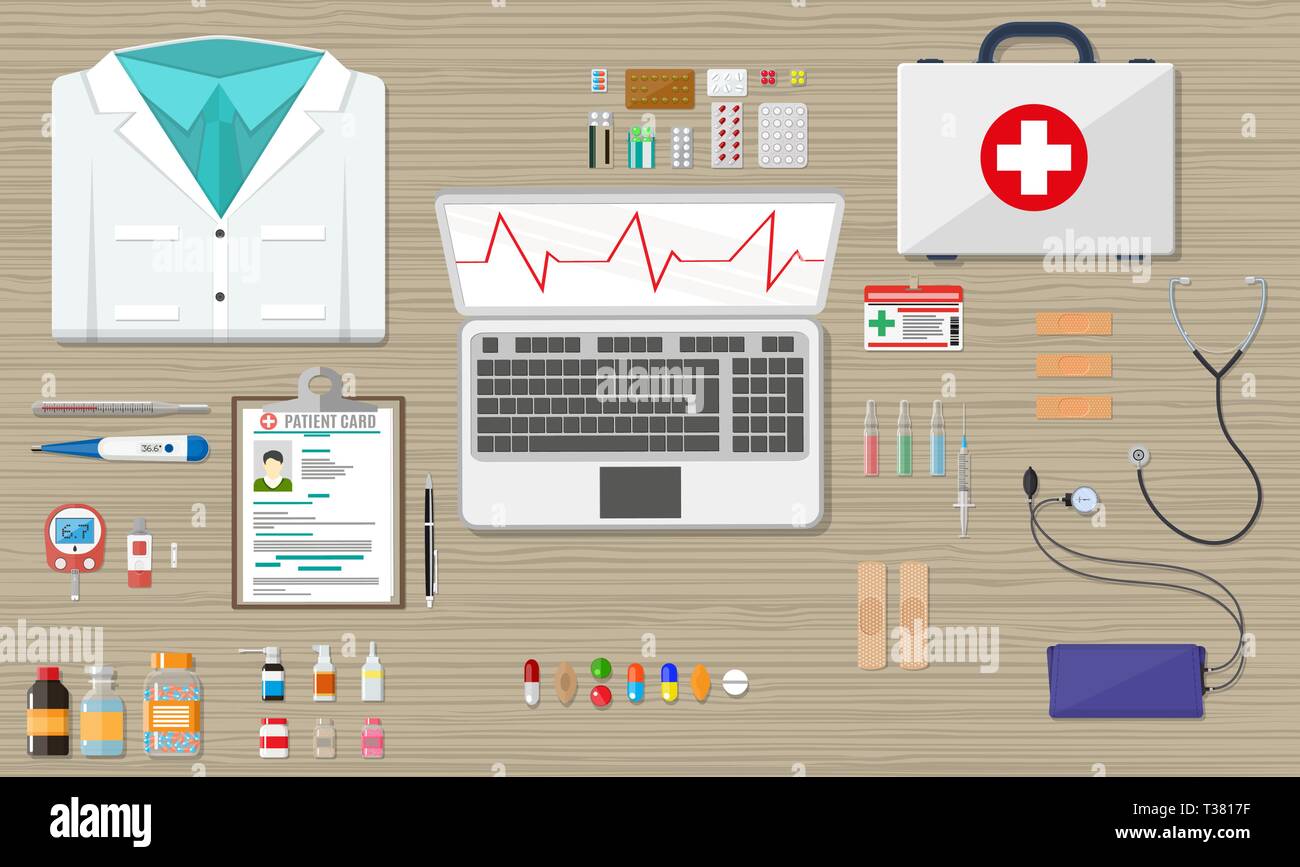 Wooden doctors desk with laptop medical and healthcare devices and ...