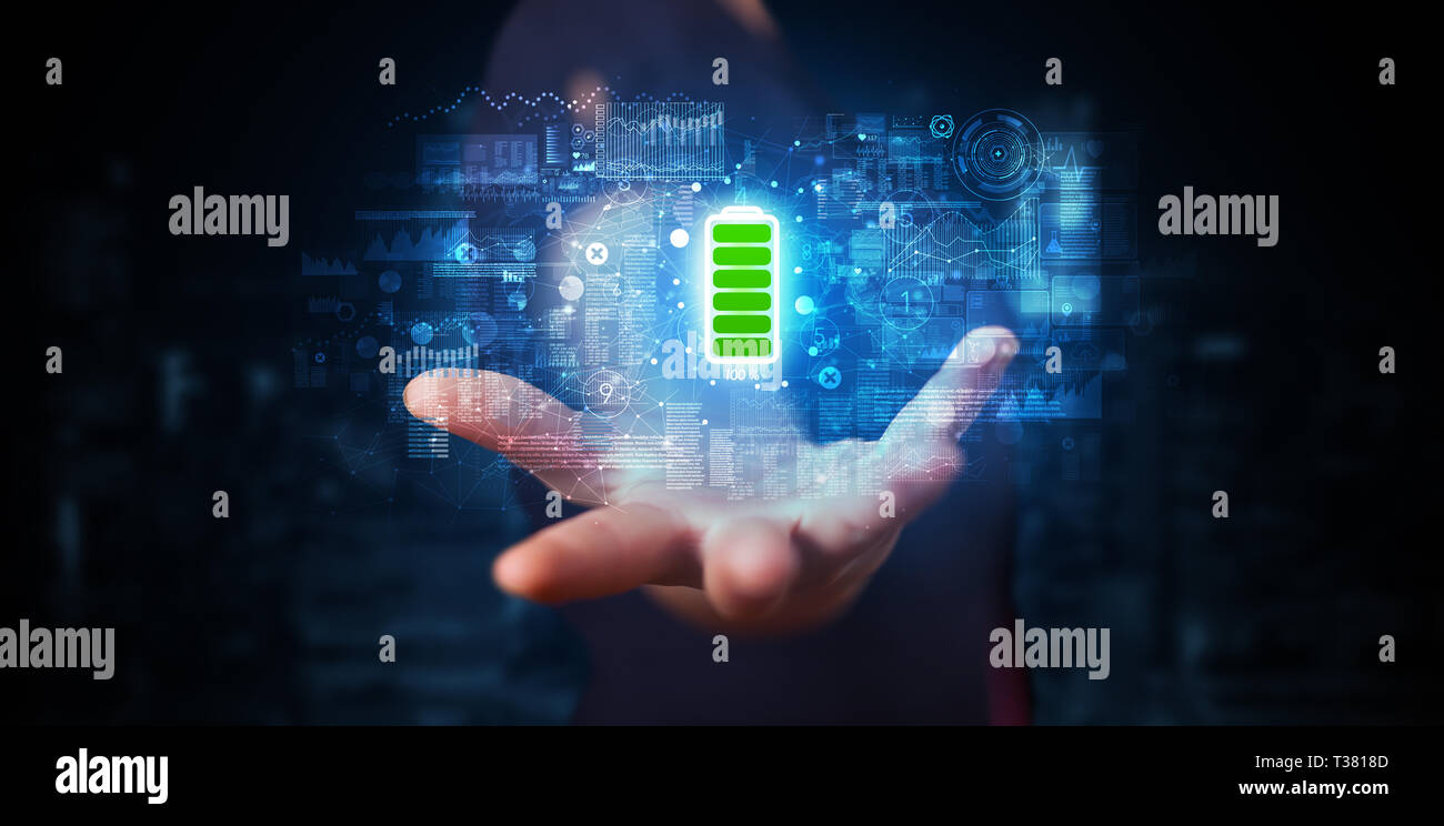 Elegant hand holding battery with full of energy Stock Photo - Alamy