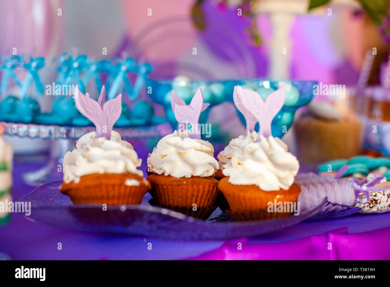 Birthday party concept for girl. Table for kids with cupcakes with ...