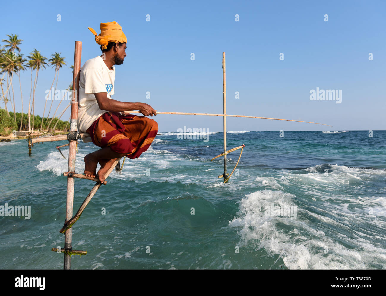 Colombo, Sri Lanka. 7th Apr, 2019. A stilt fisherman is seen at a beach ...