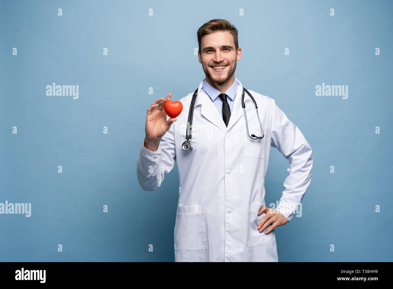 healthcare and medical concept - male doctor with heart Stock Photo - Alamy