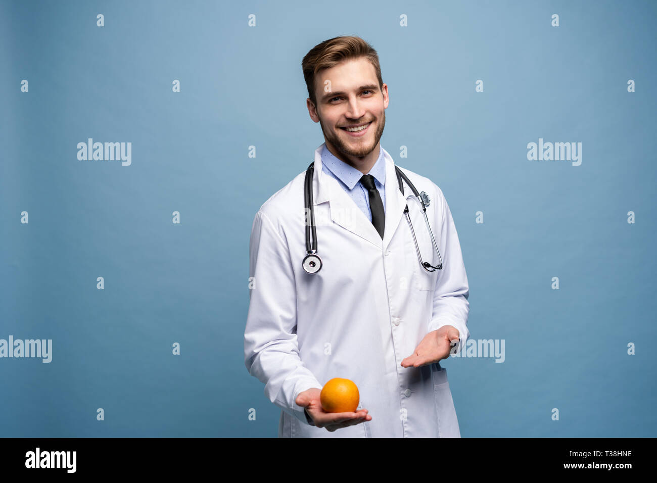 Doctor with orange hi-res stock photography and images - Alamy